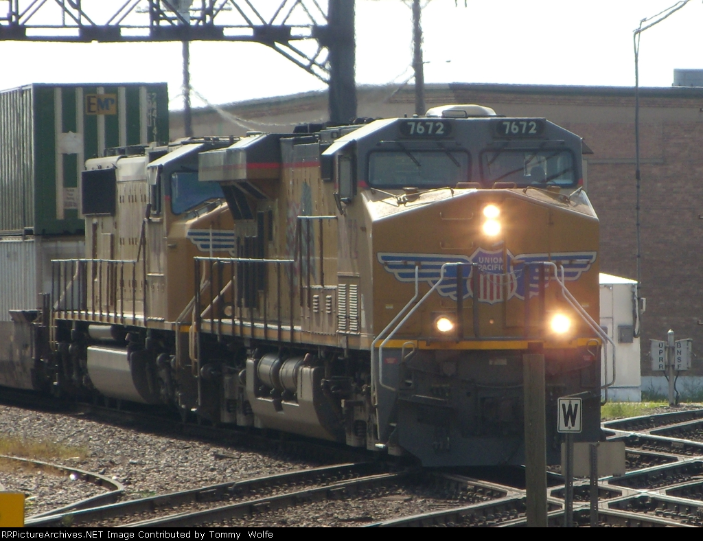 UP 7672 leads another intermodal as it pounds the dimond at Rochelle